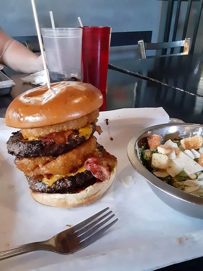 Tower of power! This double-decker burger is a skyscraper of flavor, reaching new heights of deliciousness with every bite.