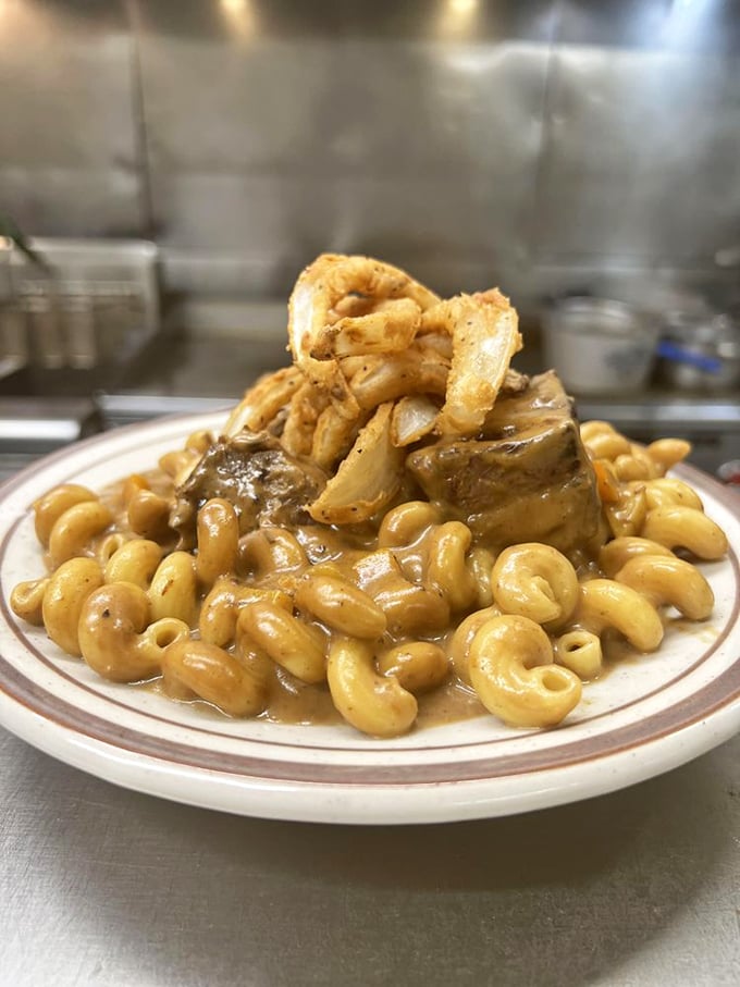 Comfort food elevated: tender short rib nestled on a bed of pasta that's clearly been swimming in something magical.