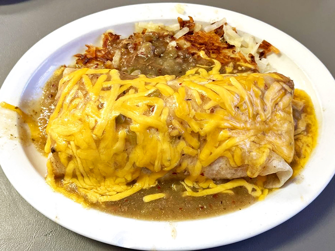 Breakfast burrito or edible work of art? This cheese-draped beauty is ready for its close-up – and your eager fork.