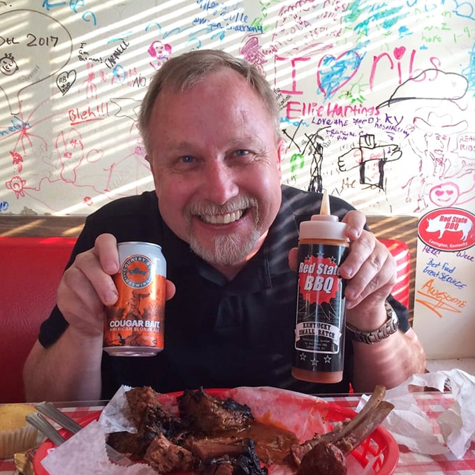 Say cheese! This happy diner's grin says it all – when the BBQ's this good, you can't help but smile. Even the sauce bottle looks like it's having a good time!