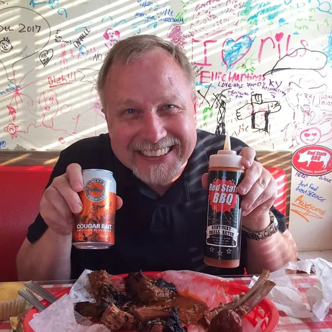 Say cheese! This happy diner's grin says it all – when the BBQ's this good, you can't help but smile. Even the sauce bottle looks like it's having a good time!