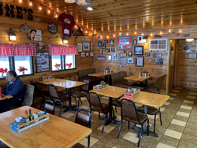 Red-checkered curtains, wood-paneled walls, and tables ready for hungry diners – the stage is set for breakfast theater at its finest.