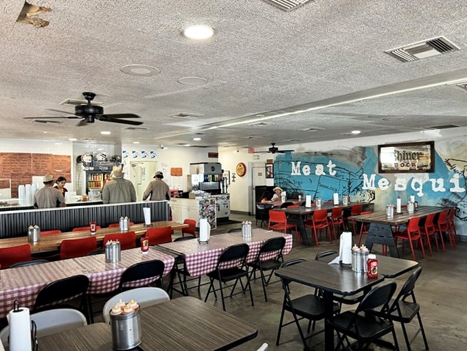 The "Meat Me" mural isn't just clever wordplay—it's the siren call that's filled these tables with barbecue pilgrims seeking enlightenment.