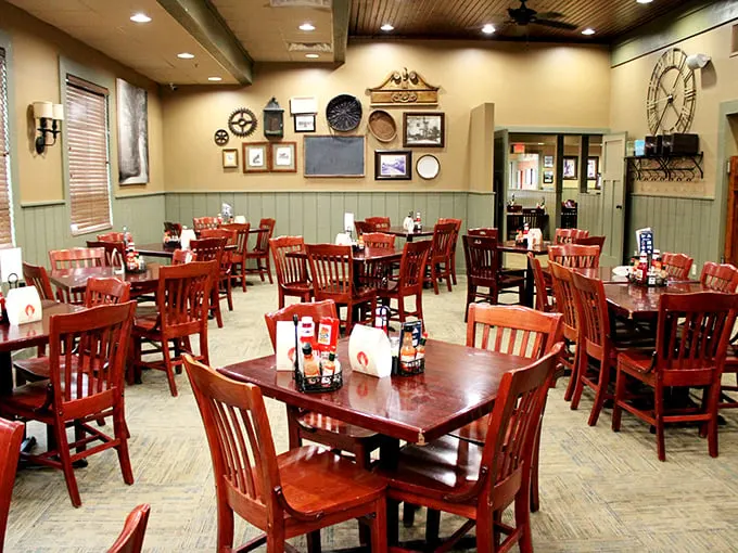 The dining room wall gallery tells stories without words—decades of community, family, and barbecue tradition hanging alongside vintage finds and local memorabilia.