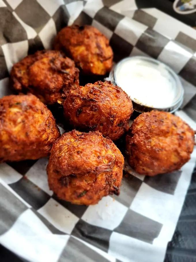 Mini crab cakes that pack a mighty flavor punch! These golden nuggets of joy prove that sometimes the best things come in small, deliciously crispy packages.