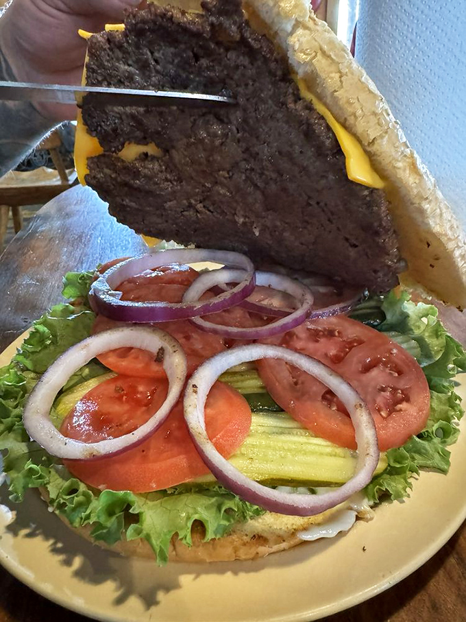 The burger that ate Manhattan. Layers of fresh veggies, melted cheese, and a patty so substantial it deserves its own zip code.