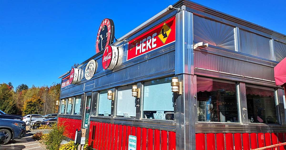 Step back in time! This retro diner's exterior is like a beacon calling all hungry time-travelers. Red, white, and chrome – the holy trinity of diner design.