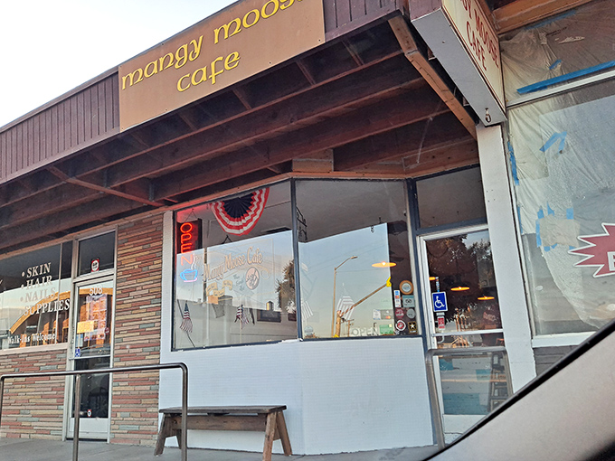 The humble yellow lettering against weathered wood says it all – great breakfasts don't need fancy facades, just like the best stories come from unexpected places.