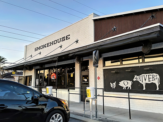The white-brick exterior of 4 Rivers Smokehouse stands like a beacon of barbecue hope in Winter Park, promising smoky salvation within those unassuming walls.