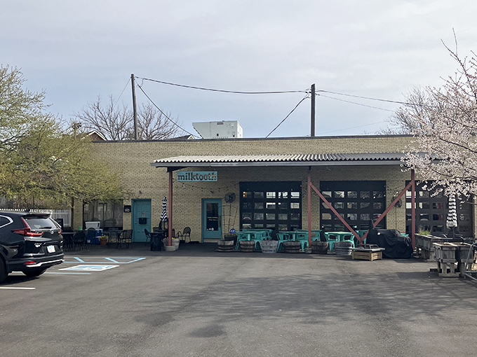 The former auto repair shop now fixes hunger pangs instead of carburetors. Milktooth's unassuming exterior hides culinary treasures within, like finding a Rolex at a yard sale.