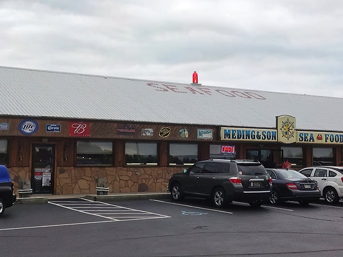 The unassuming exterior of Meding's Seafood stands like a siren call to hungry travelers. No fancy frills, just the promise of seafood treasures within.