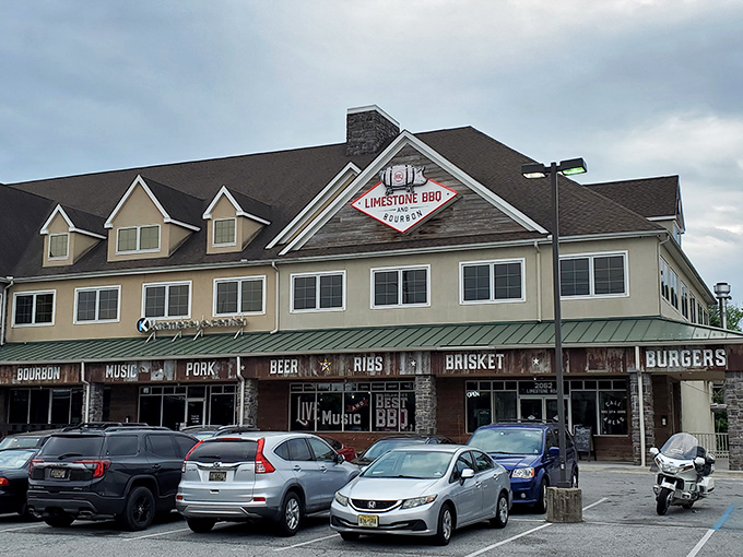 The rustic wooden façade boldly announces its priorities: RIBS, BRISKET, TACOS. No false advertising here—just a promise of smoky delights within.