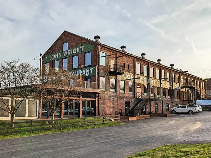 This imposing brick fortress isn't guarding the crown jewels—it's protecting something better: seafood treasures waiting to be discovered inside John Wright Restaurant.