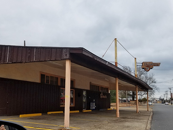 The weathered sign and modest exterior hide a temple of donut perfection that's been an El Dorado institution for generations.