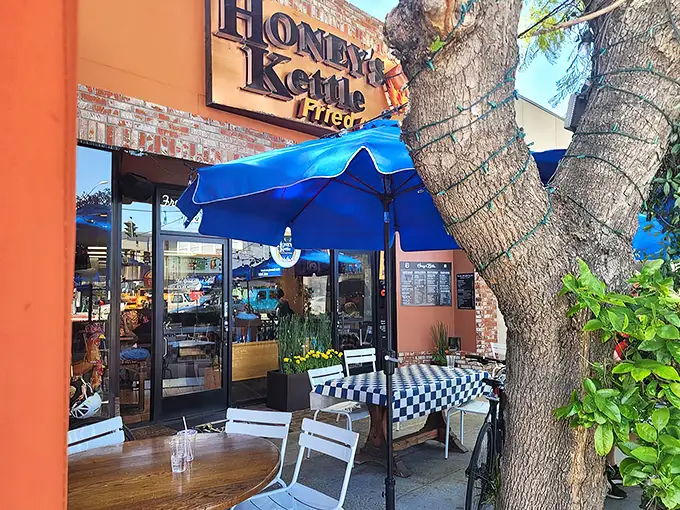 The vibrant orange facade of Honey's Kettle beckons like a beacon of fried chicken salvation on a hungry Culver City afternoon.