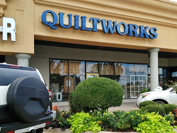 The sunny yellow door of Oklahoma Quiltworks beckons fabric enthusiasts like a textile Bat-Signal. Creative adventures await inside this unassuming storefront.