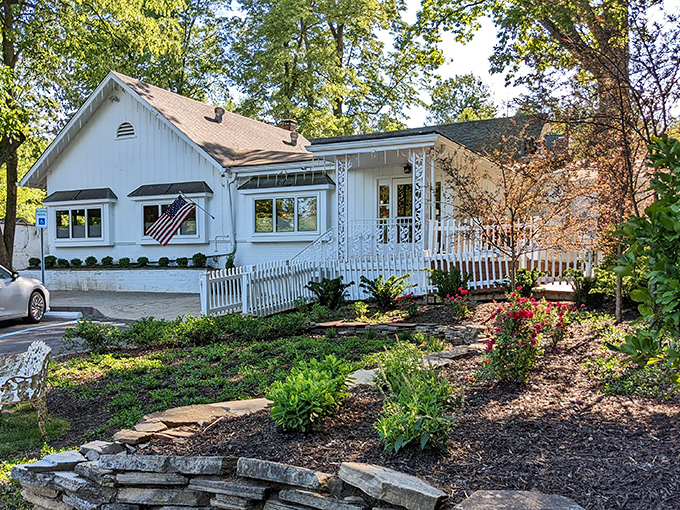 Hollyhock Hill's charming white exterior promises comfort before you even step inside, like a warm hug from your favorite aunt.
