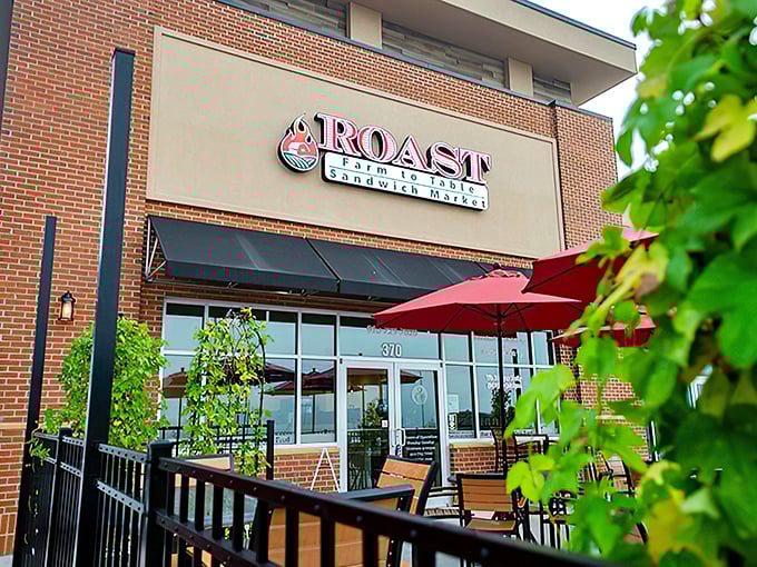 Roast's inviting brick façade with cheerful red umbrellas isn't just curb appeal – it's your first hint that sandwich nirvana awaits inside. 