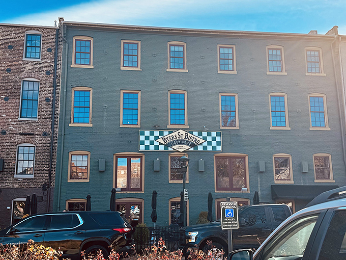 The mint-green historic building with its distinctive checkerboard sign stands like a culinary lighthouse in downtown Staunton, beckoning hungry travelers with promises of comfort.