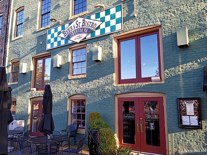 The mint-green historic building with its distinctive checkerboard sign stands like a culinary lighthouse in downtown Staunton, beckoning hungry travelers with promises of comfort.