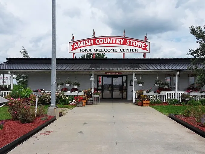 The iconic red sign beckons like a lighthouse for hungry travelers – proof that the best discoveries often happen when you actually exit the interstate.