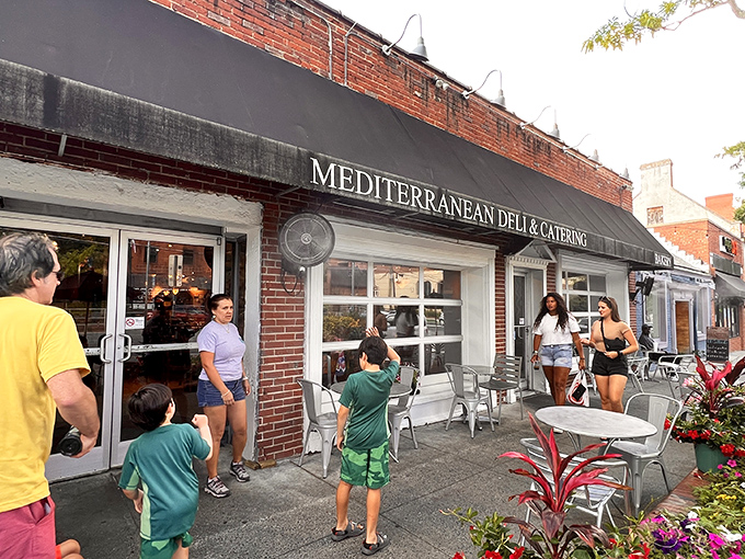 A humble brick storefront that holds more culinary treasures than your grandmother's secret recipe box. Mediterranean Deli's exterior promises authentic flavors within.
