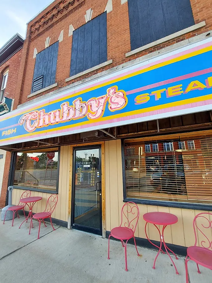 The iconic blue and pink awning of Chubby's beckons like a beacon to hungry travelers. Small-town charm with big-time flavor credentials.