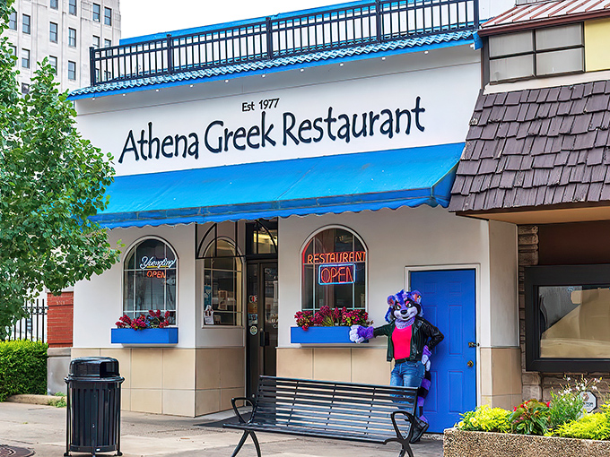 The blue-and-white façade of Athena Greek Restaurant stands like a Mediterranean oasis in downtown Mansfield, promising authentic flavors and hometown hospitality.
