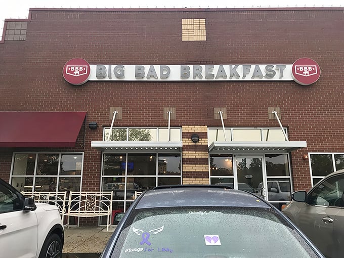 The brick fortress of breakfast dreams announces itself with that bold red awning. Big Bad Breakfast isn't whispering its presence—it's shouting delicious promises.