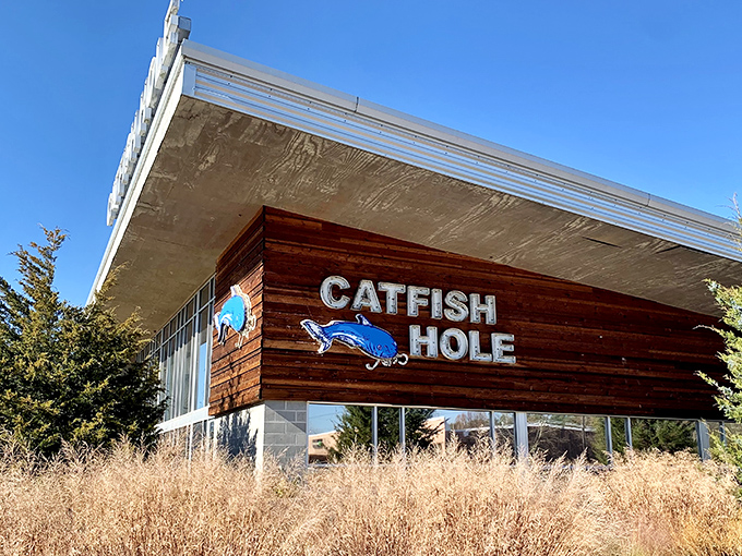 The Catfish Hole's modern exterior might fool you, but that blue catfish sign promises old-school Southern delights waiting inside.