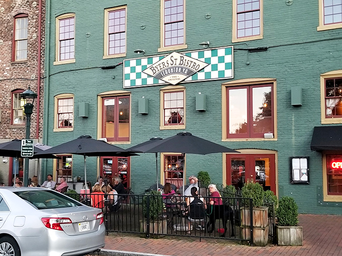 The mint-green historic building with its distinctive checkerboard sign stands like a culinary lighthouse in downtown Staunton, beckoning hungry travelers with promises of comfort.