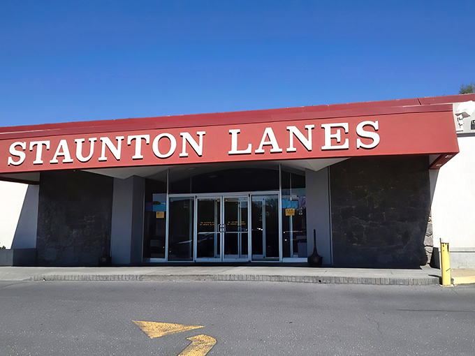 The classic red awning of Staunton Lanes welcomes visitors with retro charm, promising an afternoon of nostalgic entertainment behind those glass doors.