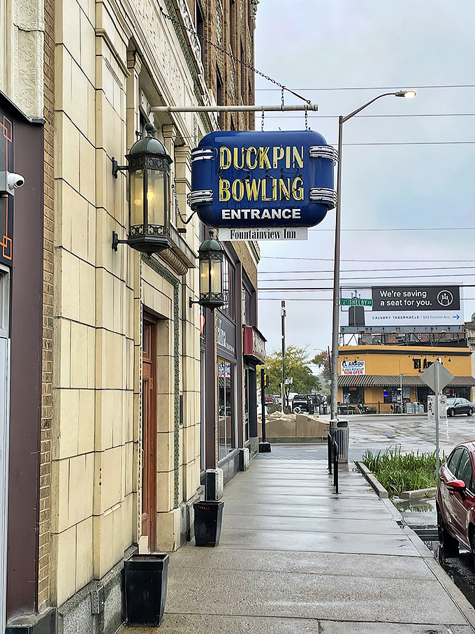 That blue neon sign beckons like a portal to another era—when entertainment moved at human speed and bowling had character.