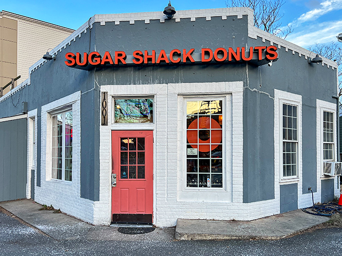 The blue-gray exterior with that coral door isn't just inviting—it's practically a siren song for your sweet tooth. Richmond's donut paradise awaits. 