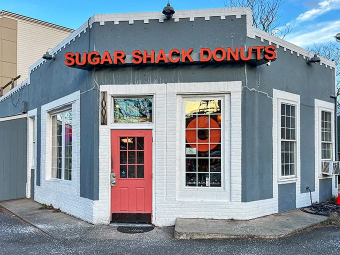 The blue-gray exterior with that coral door isn't just inviting—it's practically a siren song for your sweet tooth. Richmond's donut paradise awaits.