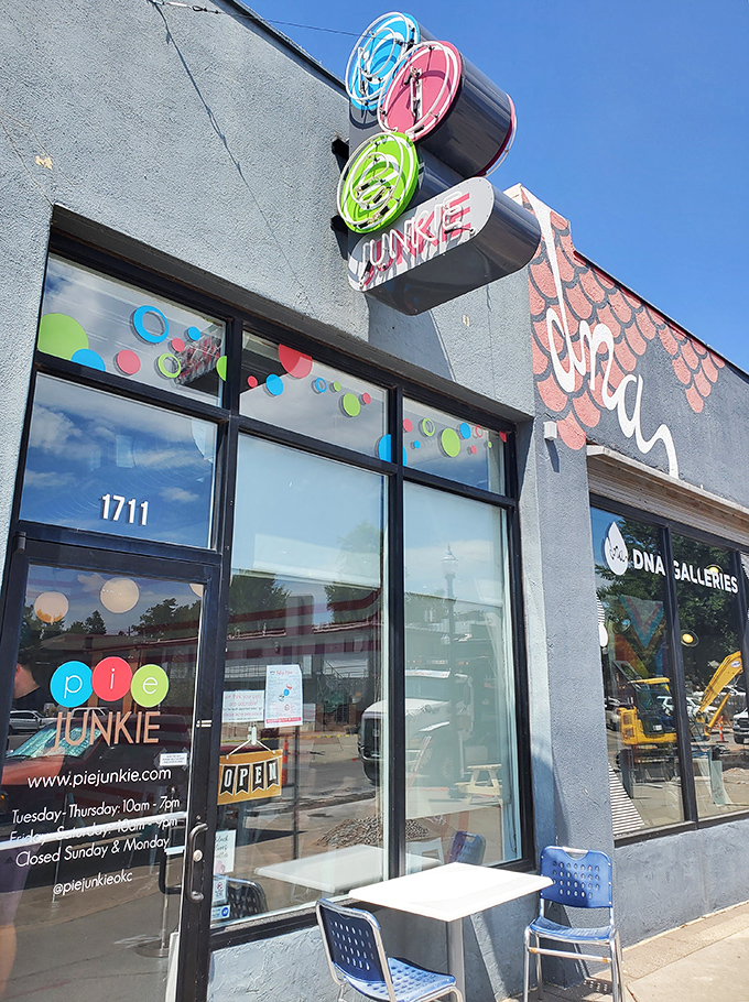 The colorful Pie Junkie storefront beckons like a siren song to dessert lovers. That sign isn't just advertising—it's a promise of happiness.