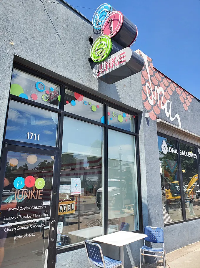 The colorful Pie Junkie storefront beckons like a siren song to dessert lovers. That sign isn't just advertising—it's a promise of happiness.