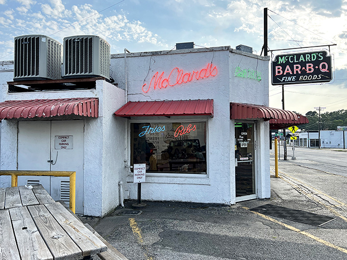 The unassuming white cinderblock exterior of McClard's—proof that in barbecue, as in life, it's what's inside that counts.
