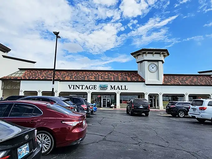 The Spanish-style facade with its signature clock tower offers zero hints about the time-traveling adventure waiting inside this unassuming Oklahoma strip mall.