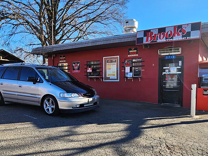 The humble red cinderblock building houses Charlotte's burger royalty—a no-frills temple to flat-top perfection since 1973.