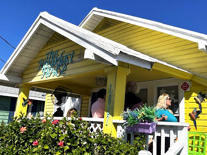 The sunshine-yellow cottage that houses The Breakfast House isn't just a restaurant—it's a morning promise wrapped in cheerful Florida charm.