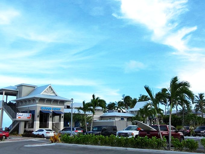 The coastal charm of Whale Harbor beckons seafood lovers with its distinctive blue signage and Keys-style architecture. Paradise found at mile marker 83.5!