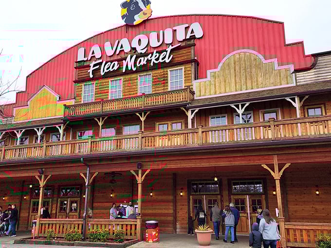 The unmistakable red barn facade of La Vaquita welcomes treasure hunters with autumn's fiery maples standing guard like colorful sentinels of bargain paradise.