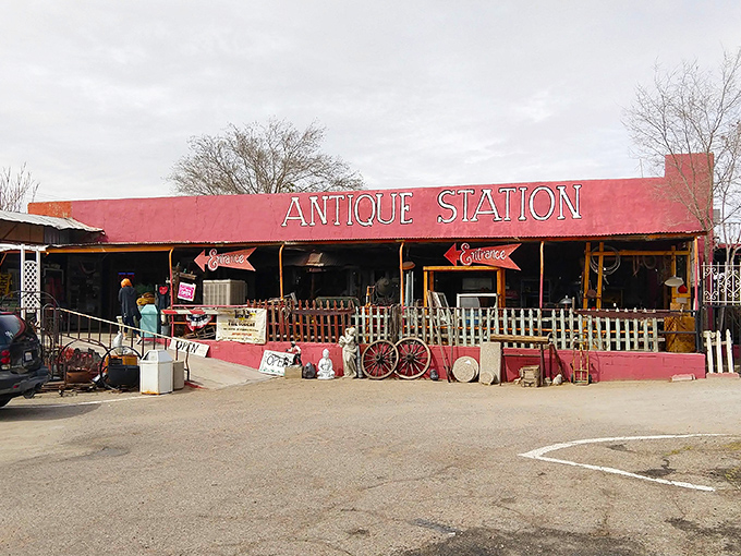 The desert sky creates a perfect backdrop for Antique Station's vibrant red façade. Route 66 charm doesn't get more authentic than this roadside treasure trove.