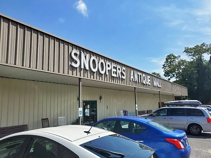 The unassuming exterior of Snoopers Antique belies the wonderland within. Like a treasure chest disguised as a toolshed, it patiently waits for curious explorers.