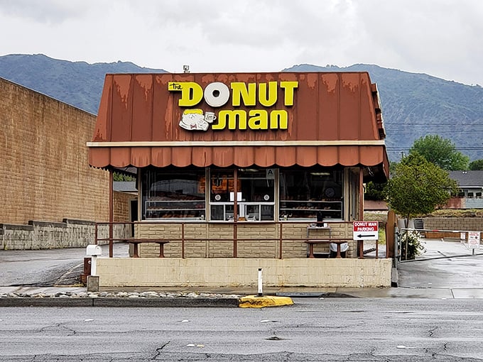 The brown building with the iconic yellow sign has become a Route 66 landmark. Like a donut beacon in the night, it calls to hungry travelers.