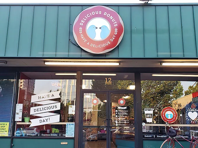 The unassuming green storefront of Delicious Donuts stands like a beacon of hope for carb enthusiasts. Portland's best-kept secret hides in plain sight.