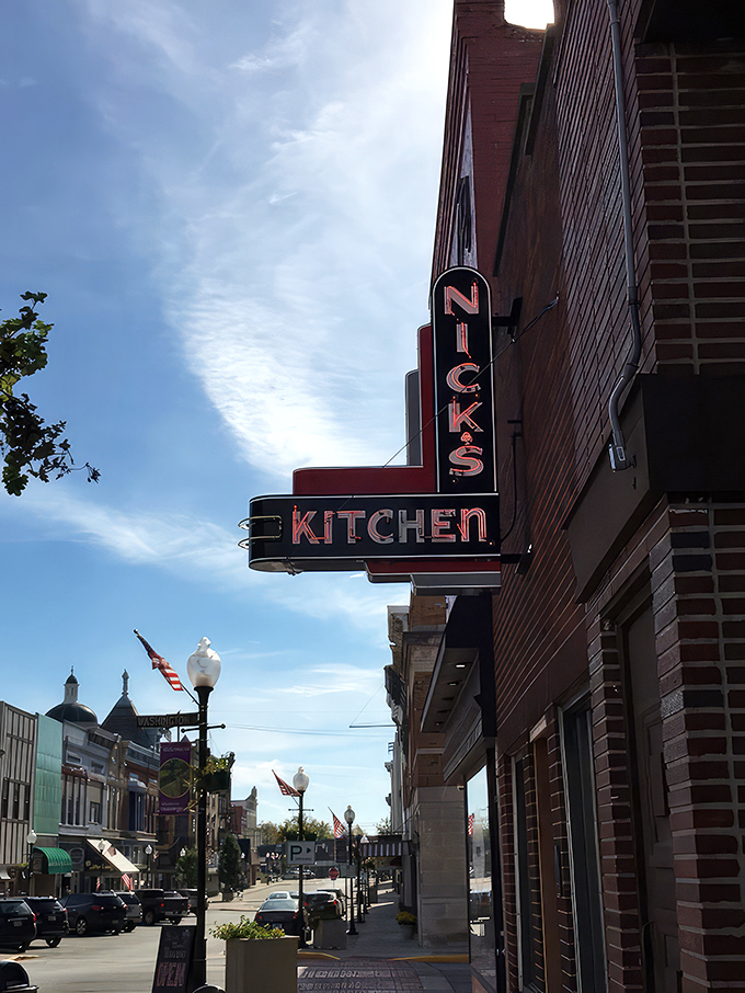 That classic neon sign against brick isn't just advertising – it's a beacon of hope for hungry Hoosiers seeking comfort food salvation.