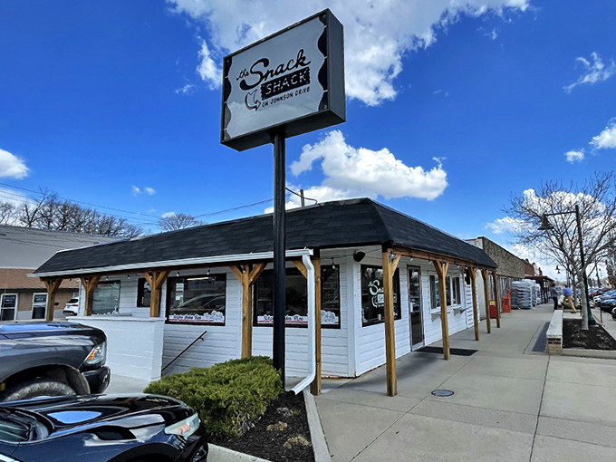 The humble white exterior of The Snack Shack belies the flavor explosions happening inside. American flag included—because patriotism tastes delicious.