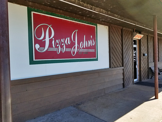 The unassuming exterior of Pizza John's in Derby might not stop traffic, but locals know this modest storefront houses pizza greatness.